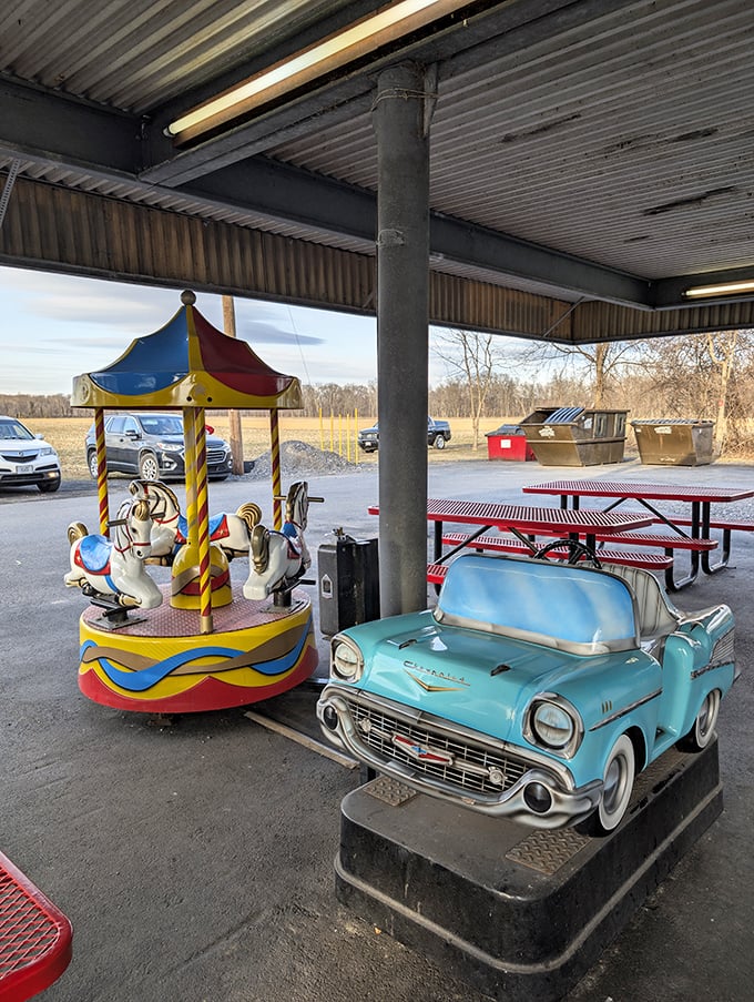 The cheeseburger in its natural habitat&mdash;your car. Notice how the melted American cheese drapes over the patty like a warm, yellow security blanket.