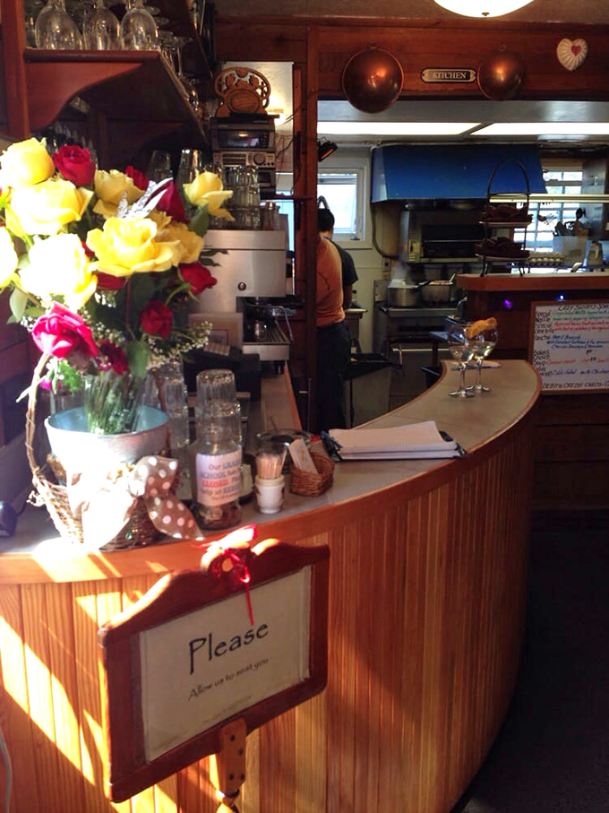 The host station doubles as a flower display and mission control. That "Please" sign isn't asking&mdash;it's gently commanding good manners.