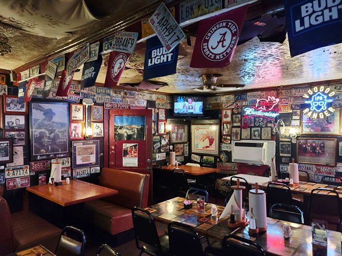 Crimson Tide memorabilia shares wall space with decades of barbecue history. In Tuscaloosa, these are the two religions that unite everyone.