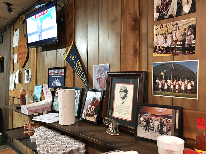 The wall of memories and memorabilia isn't random decoration&mdash;it's a community scrapbook built one photograph and pennant at a time.