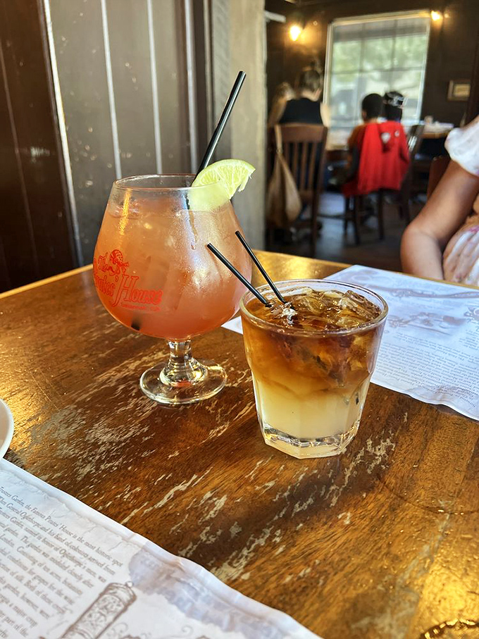 Tropical-hued cocktails that promise vacation vibes in every sip, even if your only travel plans involve the drive back home.