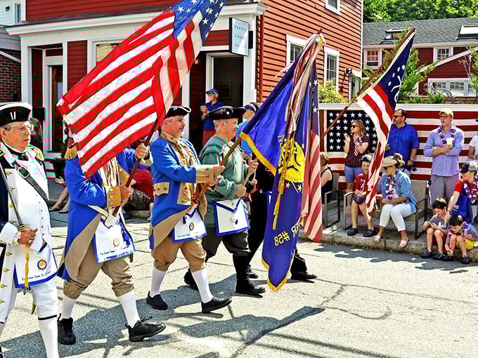 Revolutionary War reenactors march through town during summer festivals, bringing history to life with authentic passion and impressive hats.