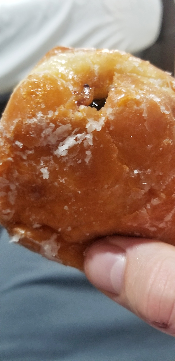 Up close with donut perfection. That golden-brown exterior and pillowy interior&mdash;a textural masterpiece worth waking up early for.