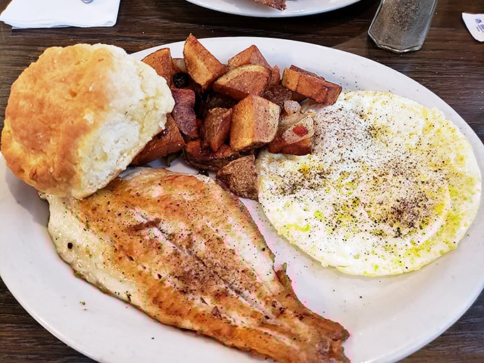 A breakfast plate where the fish isn't playing second fiddle to anything&mdash;except maybe that golden biscuit standing tall like a carb monument.