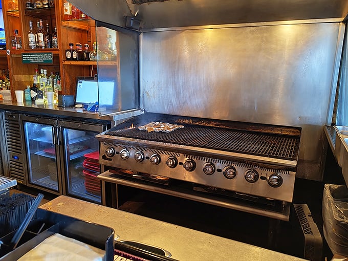 Where the magic happens&mdash;this grill has seen more seafood than most fishing boats. Simple tools in the hands of people who know what they're doing.