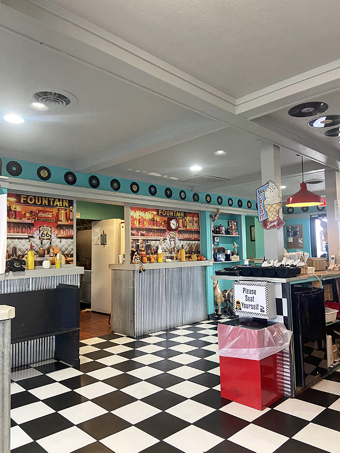 Route 66 spirit captured in every corner, with vintage signs, old-school fountain service, and memories of the open road.