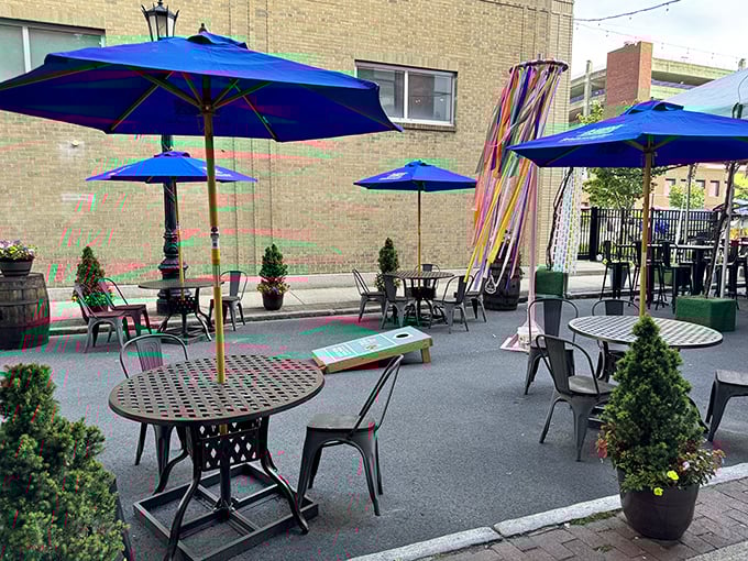 The outdoor patio offers a breath of fresh air, bright blue umbrellas creating an oasis where you can enjoy your bratwurst al fresco.