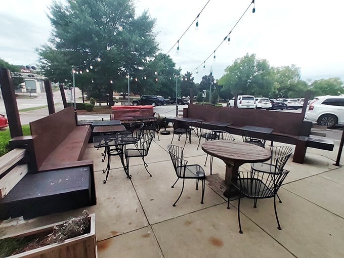The outdoor patio &ndash; where string lights and fresh air transform simple tables into prime real estate. Alabama evenings were made for spaces exactly like this.