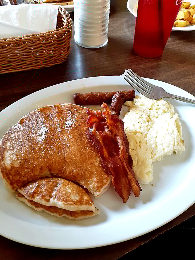 Pancakes so perfectly golden they belong in a breakfast hall of fame. With eggs, bacon, and sausage, this is the breakfast trifecta.