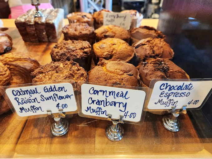 The muffin lineup reads like a delicious novel &ndash; Oatmeal Golden Raisin Sunflower, Cornmeal Cranberry, and Chocolate Espresso each starring in their own chapter.