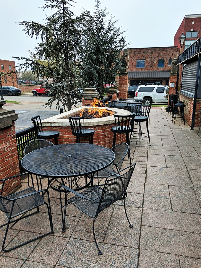The patio fire pit isn't just outdoor seating&mdash;it's therapy. Something primal happens around flames and food that no psychiatrist can explain.