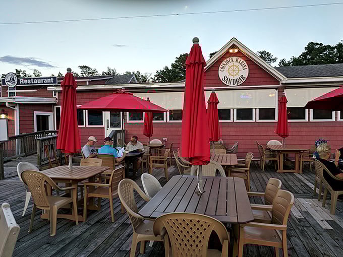 The outdoor deck&mdash;where the breeze carries conversations and the red umbrellas provide shade for decisions about second helpings.