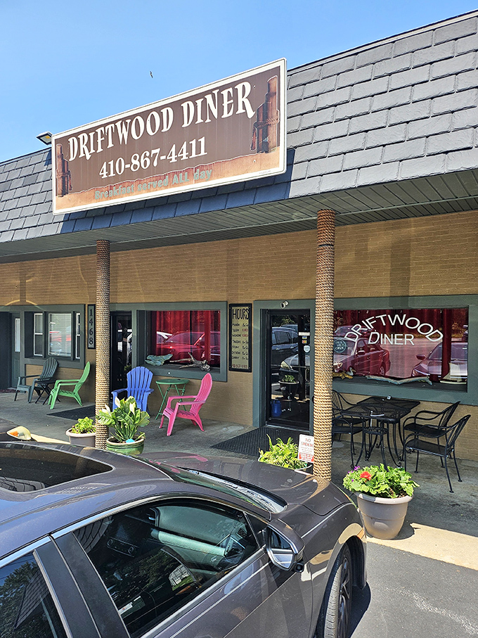 Colorful Adirondack chairs welcome visitors like old friends, promising relaxation before and after your breakfast adventure.