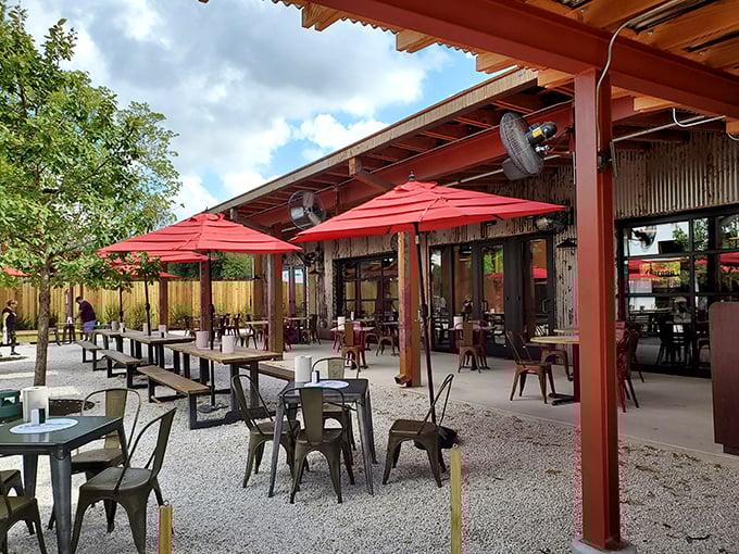 Red umbrellas dot the patio where San Antonio's perfect weather days are best enjoyed with a burger in hand.