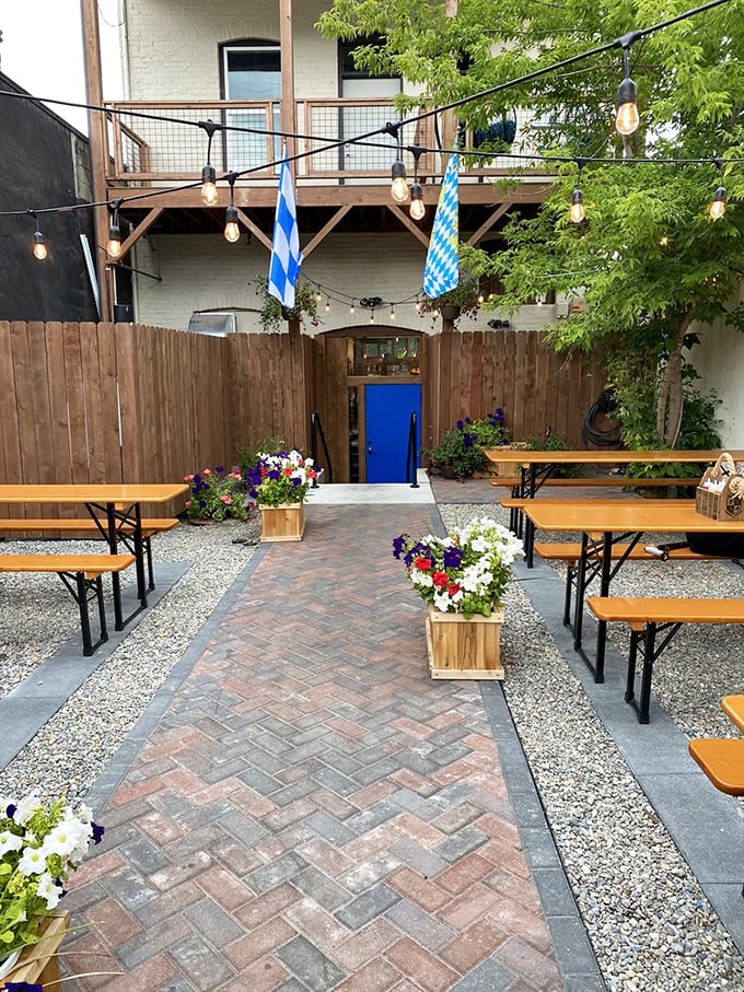 Beer garden bliss with string lights overhead. This brick-paved oasis with Bavarian flags feels like stumbling into a secret European courtyard in Idaho's backyard.