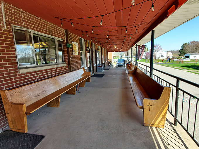 The covered porch with its handcrafted wooden benches offers the perfect spot to digest your meal while watching small-town Indiana life unfold.