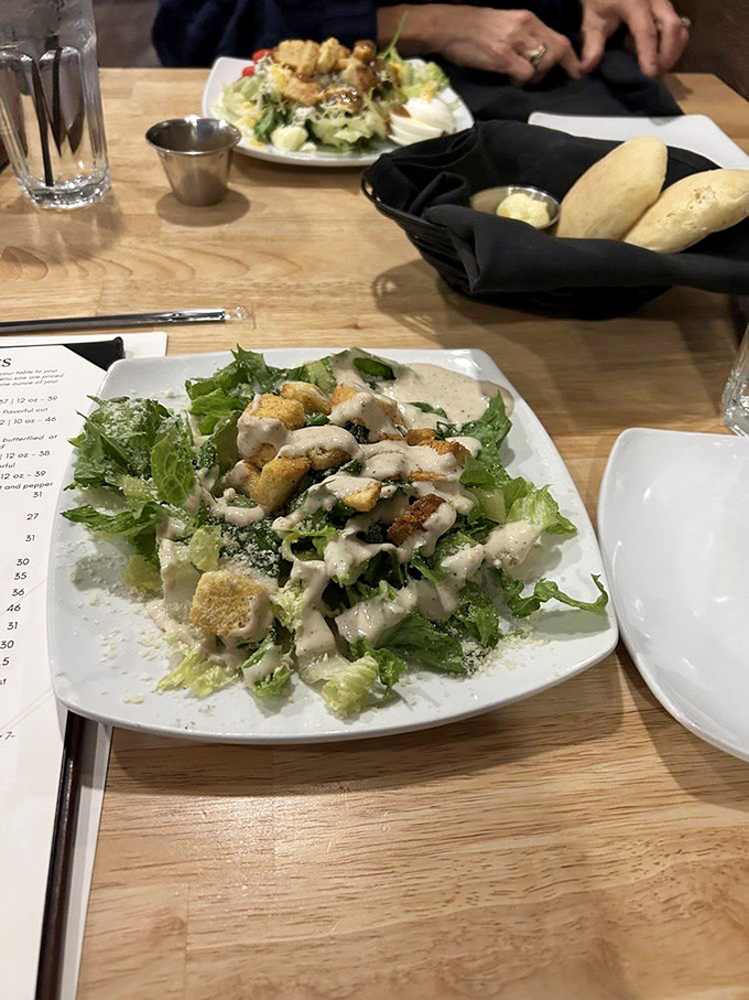 Even the salad gets star treatment here – crisp, fresh, and dressed to impress, proving green things can hold their own in a temple of beef.