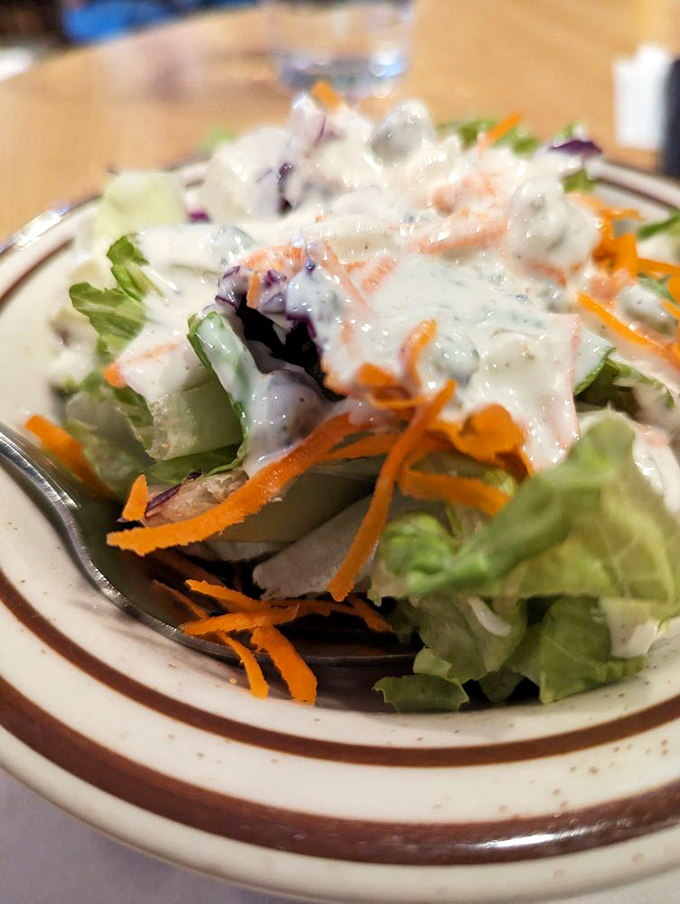 A house salad that's actually trying&mdash;fresh greens, carrots, and house dressing that proves Germans understand vegetables too.