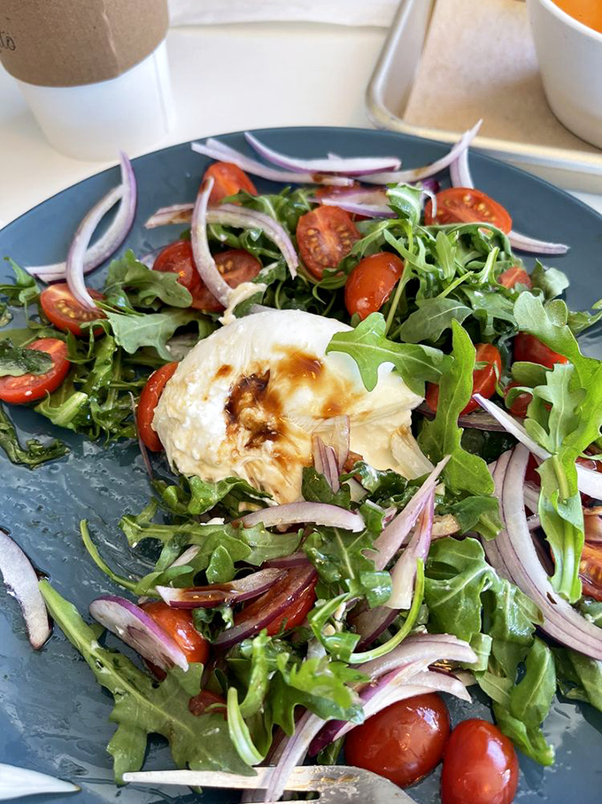 A burrata salad that's basically summer on a plate&mdash;bright tomatoes, peppery arugula, and that cloud of creamy cheese that dreams are made of.
