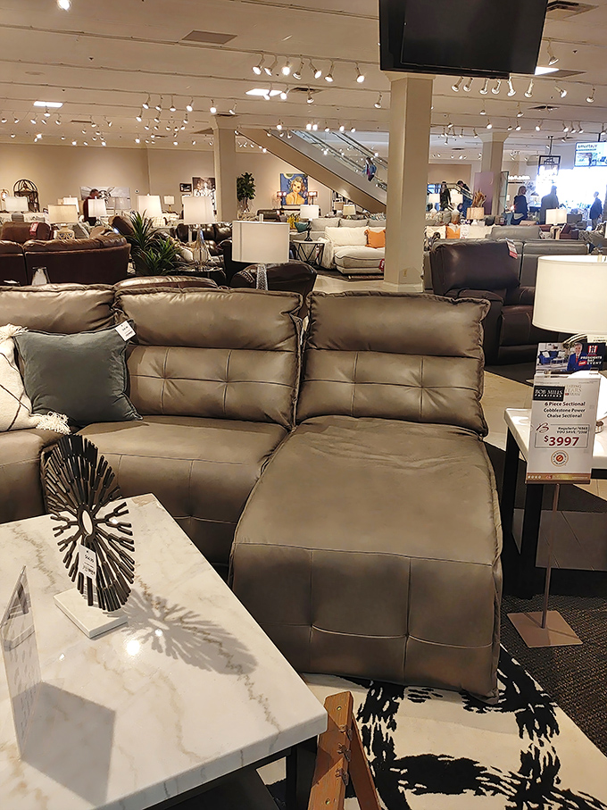 A showroom so vast you might need breadcrumbs to find your way back. The escalator promises even more furniture adventures upstairs.