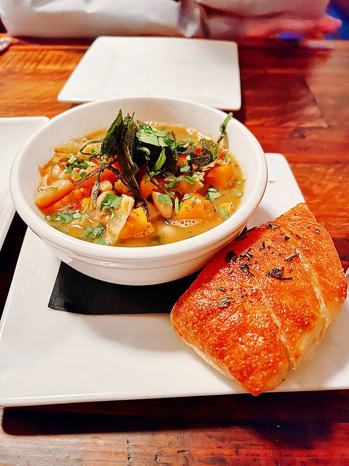 A bowl of minestrone that could cure whatever ails you, paired with bread that's clearly been working out. Comfort food with an Italian accent.