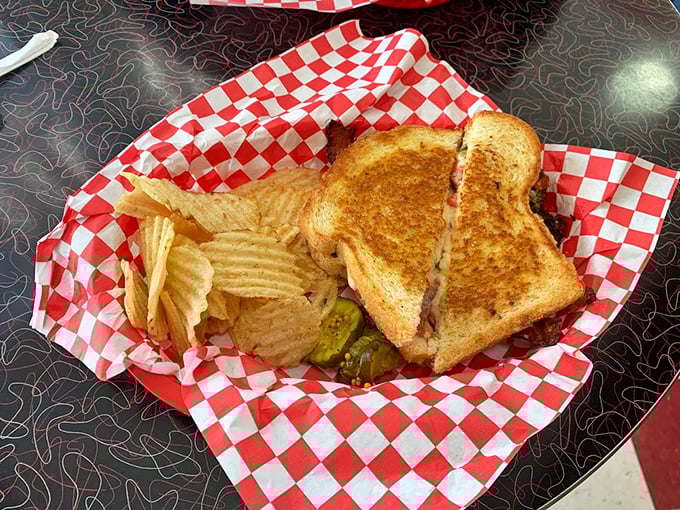 The sandwich that launched a thousand napkins—crispy bread embracing what appears to be a glorious combination of melty goodness and savory fillings.