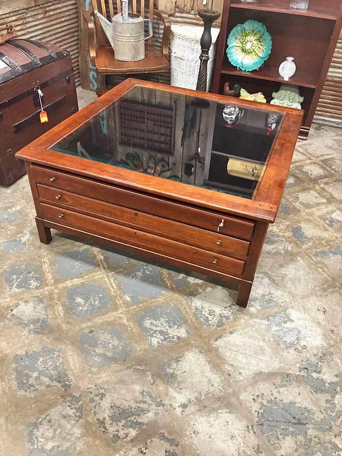 Map drawers reimagined as a coffee table with glass top &ndash; perfect for displaying collections while secretly storing your remote control collection.