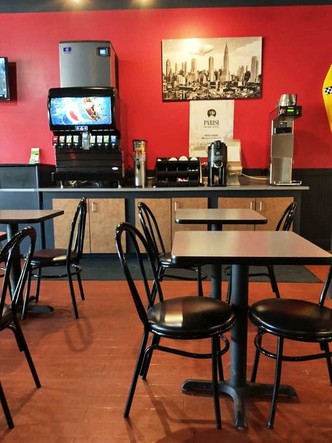 Red walls, New York skyline art, and simple tables create that perfect "I'm definitely not in Nebraska anymore" feeling while you wait for your sandwich masterpiece.