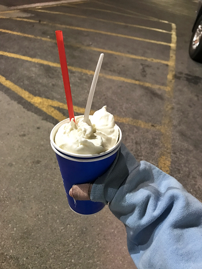 The vanilla shake stands tall and proud, topped with a cloud of whipped cream that dares you not to smile.