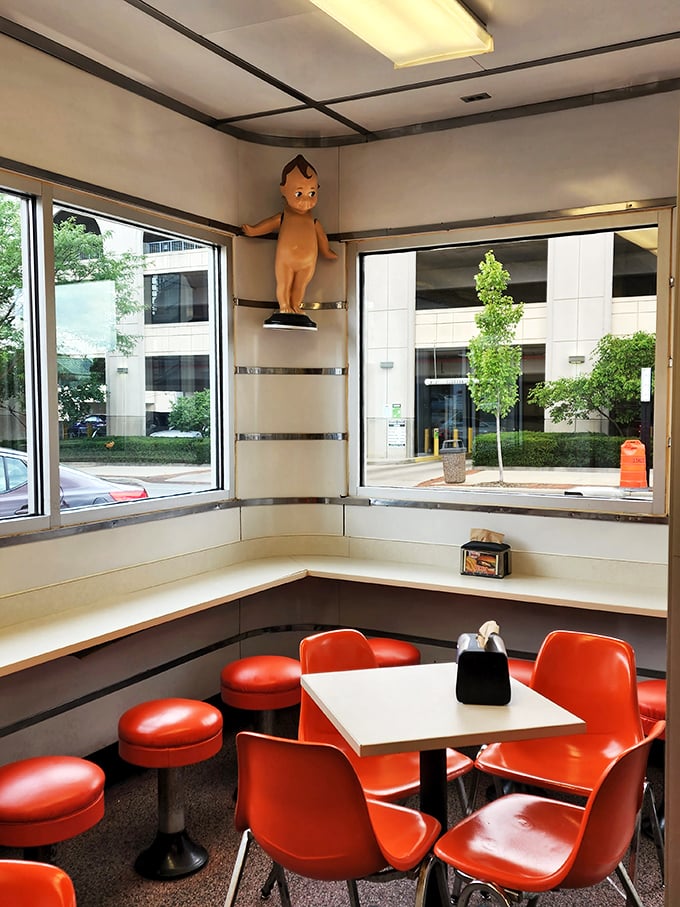 Corner seating that offers both a view of Lima life passing by and another Kewpee doll keeping watchful eyes on your dining experience.