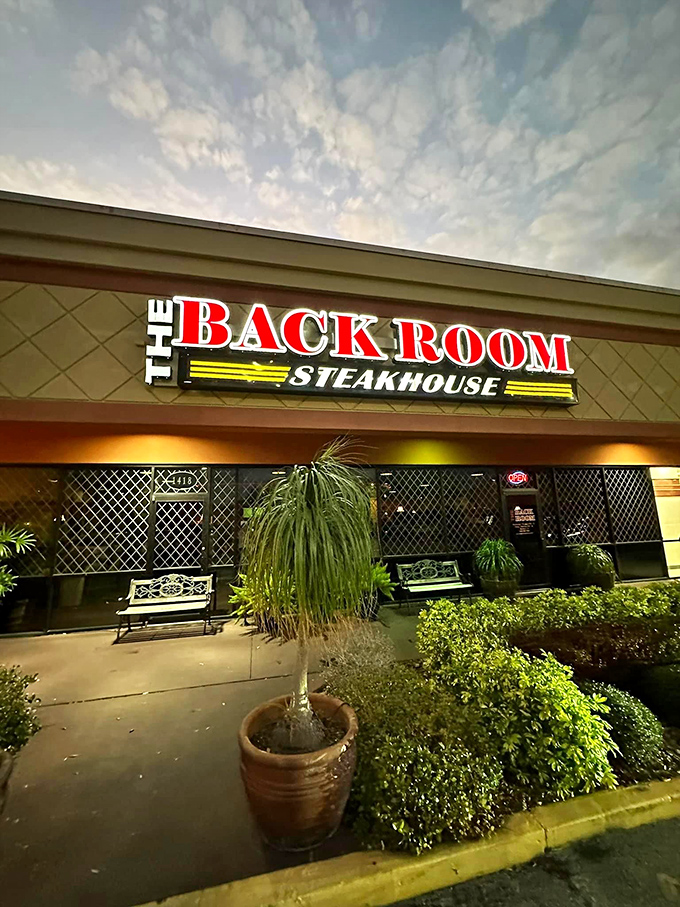 The Back Room's bold red sign cuts through the night – a beacon for those seeking steak salvation in Apopka.