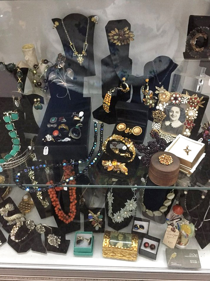 Vintage jewelry waits patiently behind glass, each piece carrying stories of celebrations, heartbreaks, and fashion statements from eras gone by.