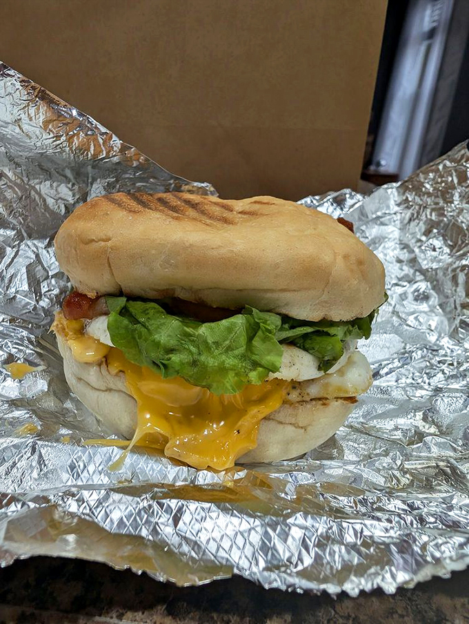 This breakfast sandwich isn't messing around&mdash;the melted cheese cascading down the side is nature's way of saying "good morning, champion."