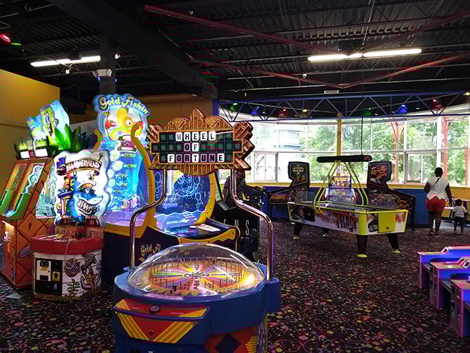The arcade's flashing lights and colorful carpet create a sensory playground where quarters transform into potential glory and stuffed animal trophies.