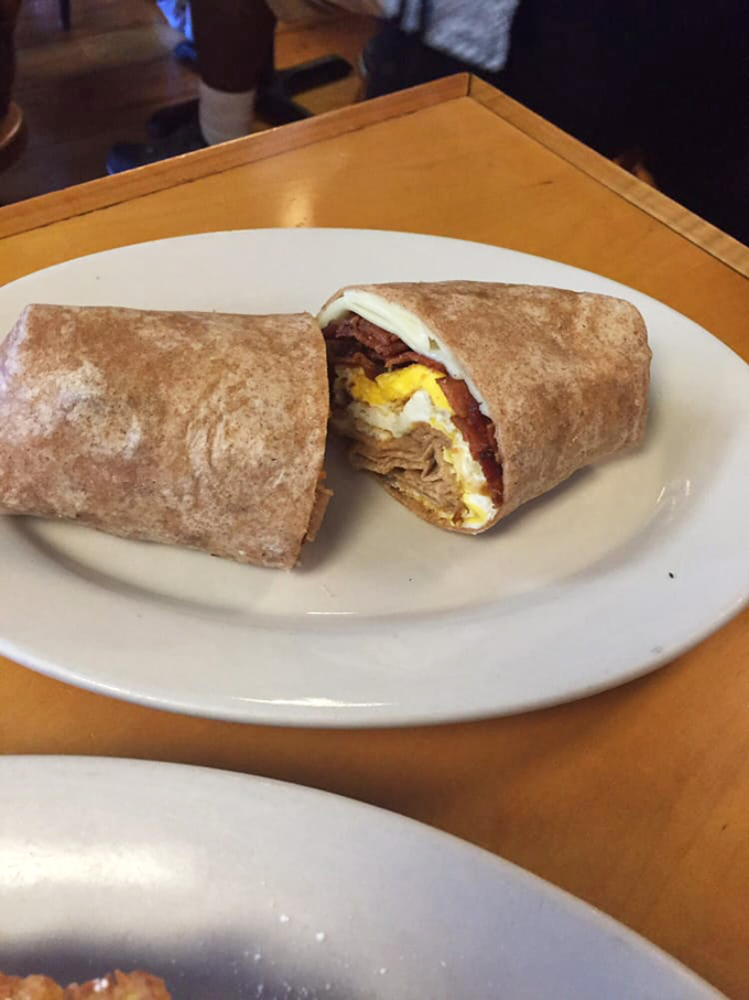 The humble breakfast wrap transformed into portable perfection. One hand for your coffee, one hand for this savory morning bundle.