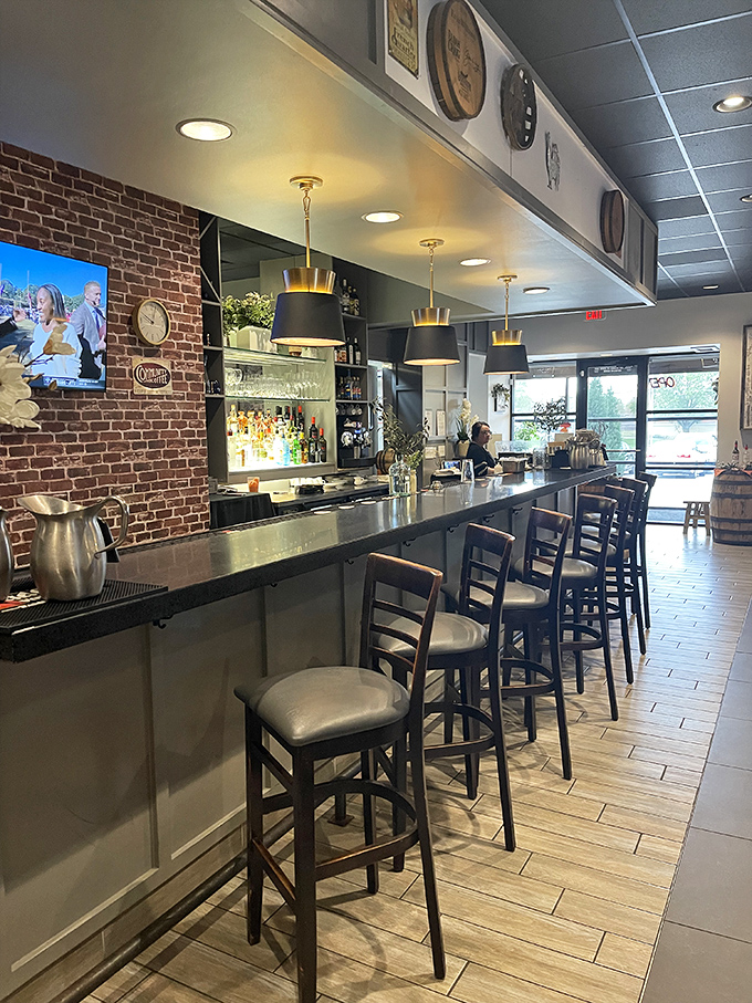 The bar at Magnolia Cafe isn't just where drinks are made&mdash;it's where stories begin. Those gold-accented pendant lights cast the kind of glow that makes everyone look like they're having the time of their lives.