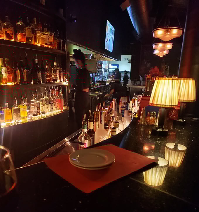 At this bar, the bottles glow like treasure in a pirate's cave. The cocktails? They're liquid gold.