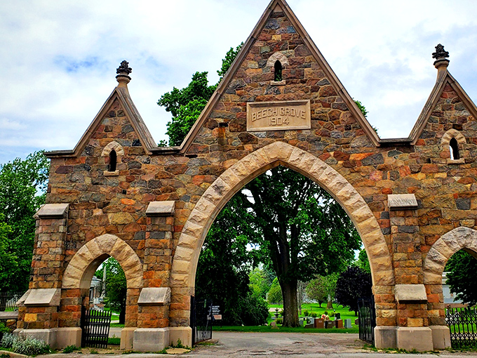 Beech Grove Cemetery's stone arches stand as a hauntingly beautiful gateway between worlds, their 1914 craftsmanship a reminder of artisanal dedication.