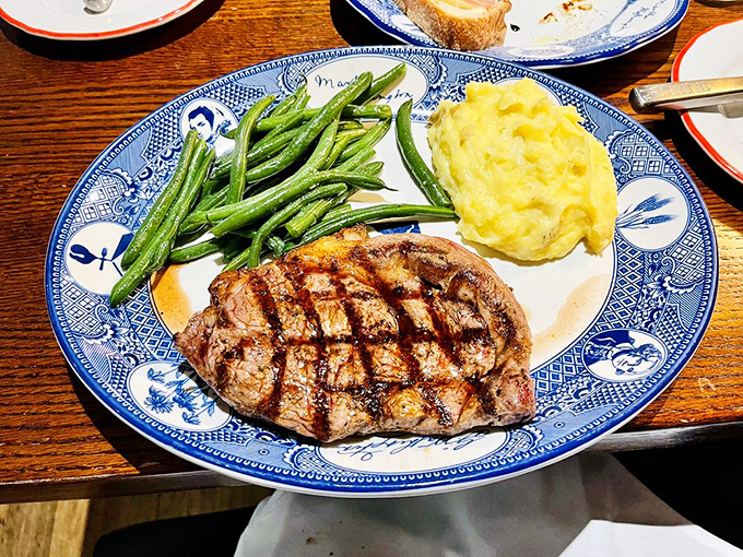 A steak that means business, flanked by vibrant green beans and creamy mashed potatoes. This is the dinner equivalent of a power suit&mdash;impressive and reliable.