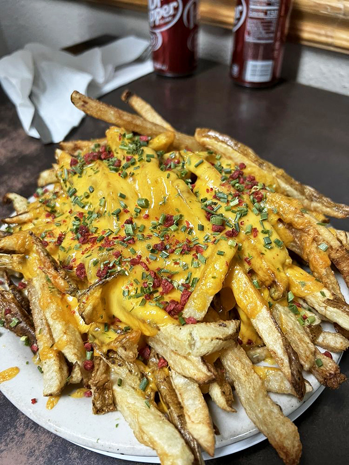 Cheese fries that look like they've been blessed by the dairy gods – crispy, gooey, and worth every extra minute on the treadmill.