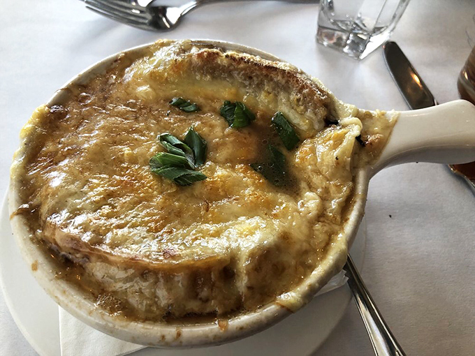 French onion soup that's practically wearing a cheese toupee&mdash;a bubbling cauldron of sweet onions and savory broth beneath a golden crown.