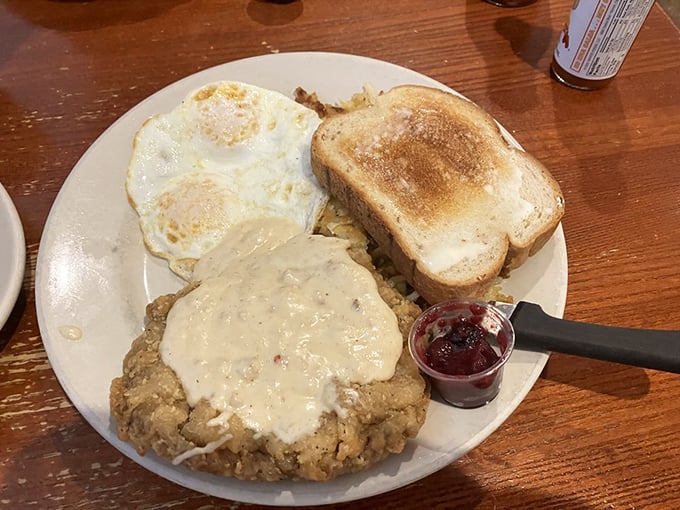Chicken fried steak smothered in country gravy with eggs and toast&mdash;the breakfast that says, "You won't need lunch today, partner."