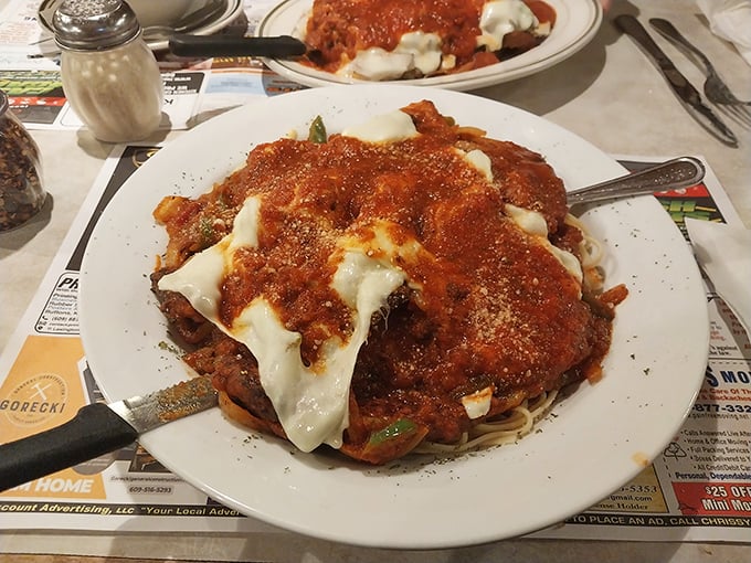 Italian-American comfort in its purest form: chicken parmesan that doesn't skimp on cheese or personality.