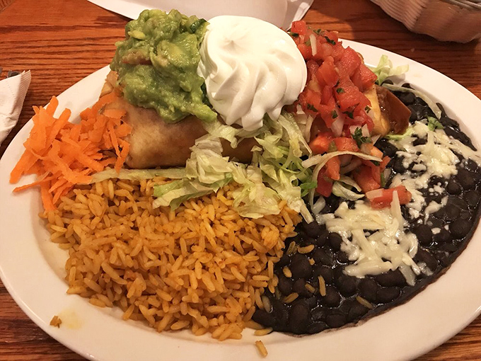 This chimichanga plate is the United Nations of flavor&mdash;rice, beans, guacamole, and sour cream all in peaceful, delicious coexistence.