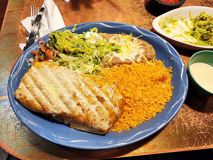 This grilled fish dish demonstrates restrained elegance&mdash;the hallmark of confident cooking. Bright rice and fresh toppings provide both color and complementary textures.