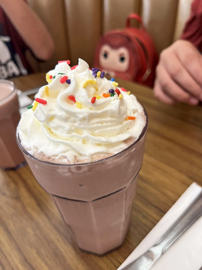 This isn't just a milkshake&mdash;it's a dessert skyscraper with whipped cream penthouse and sprinkle rooftop garden.