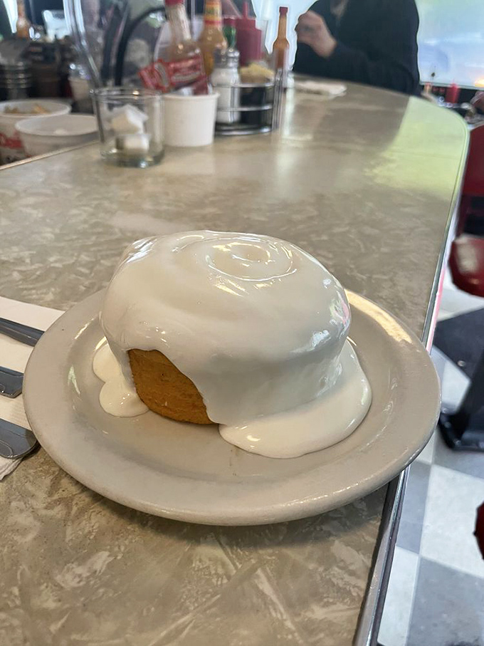 This cinnamon roll isn't just glazed&mdash;it's baptized in icing. The kind of morning indulgence that makes Monday feel like Saturday.