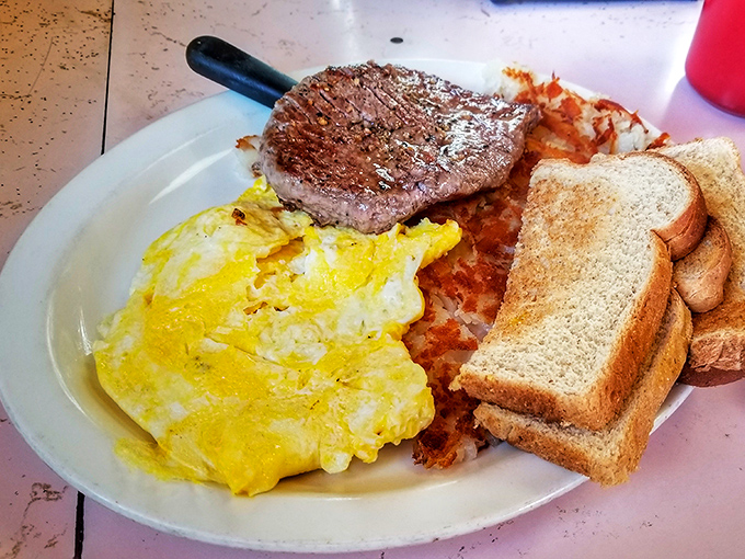 The classic American breakfast: eggs, bacon, toast, and hash browns living in perfect harmony together.