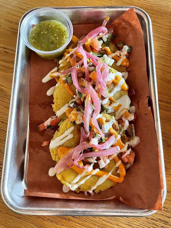 These corn cakes topped with pickled onions and sauce tell the story of Texas and Mexico's beautiful culinary friendship.