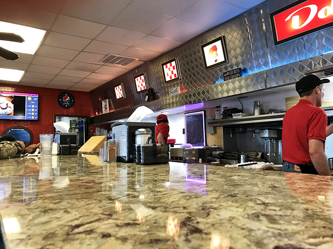 The counter offers front-row seats to the breakfast ballet. Marble surfaces reflect the overhead lights like morning sunshine on a mountain lake.
